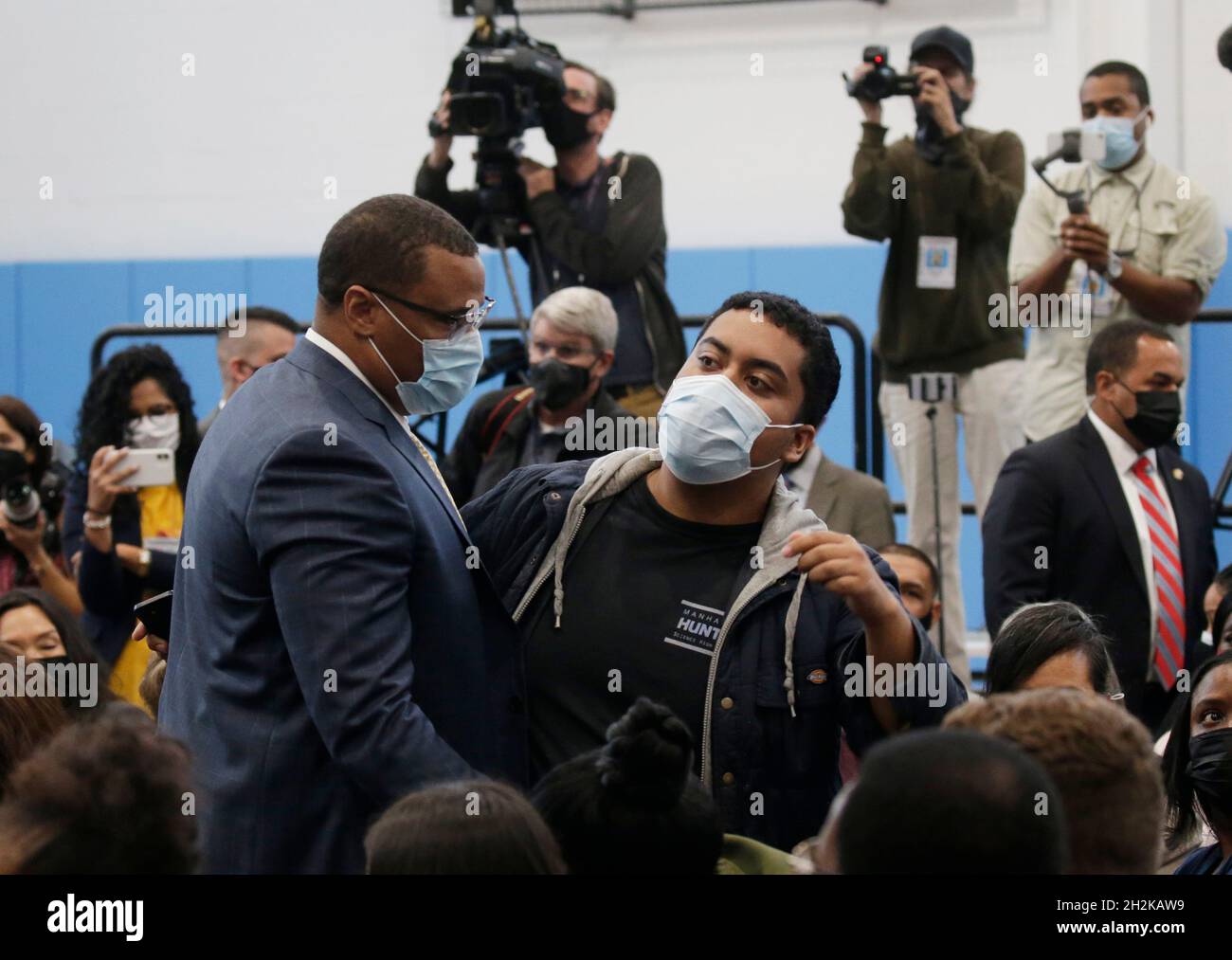 A man is escorted out of the room after standing and interupting Vice ...