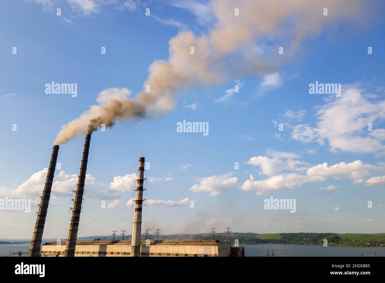 Aerial view of coal power plant high pipes with black smokestack ...