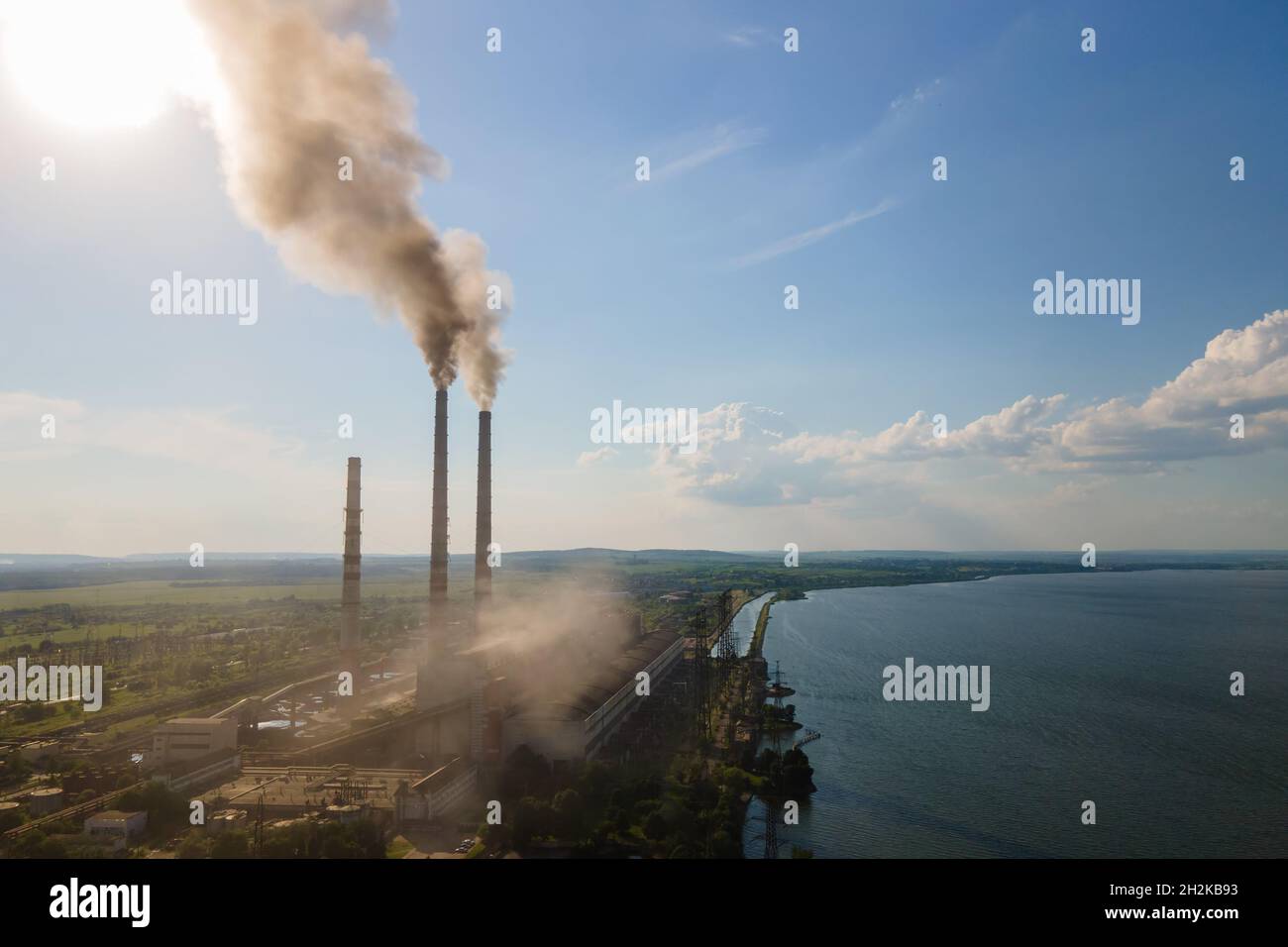 Aerial view of coal power plant high pipes with black smokestack ...
