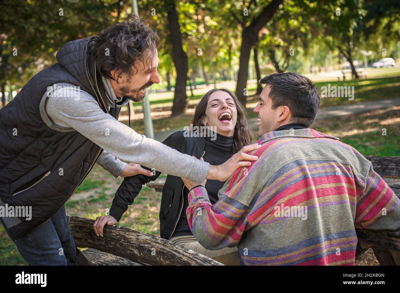 Extreme laughing and positive emotion concept. Group of three relaxed ...