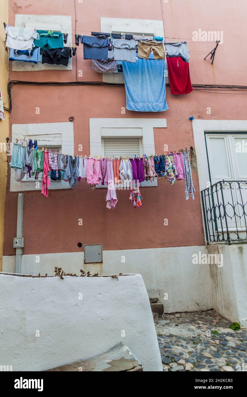 Laundry on a line in Alfama neighborhood of Lisbon, Portugal Stock ...
