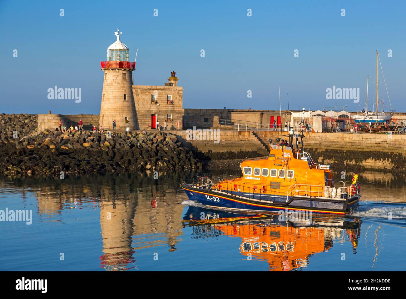 Lifeboat passing Howth Pier Lighthouse, Howth, County Dublin, Irealnd ...
