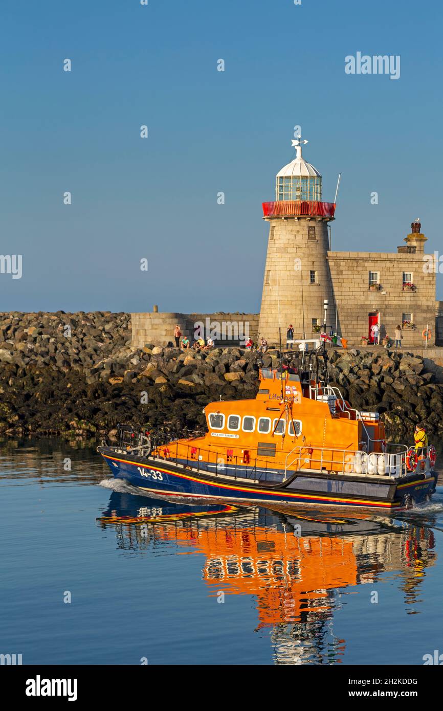 Lifeboat passing Howth Pier Lighthouse, Howth, County Dublin, Irealnd ...