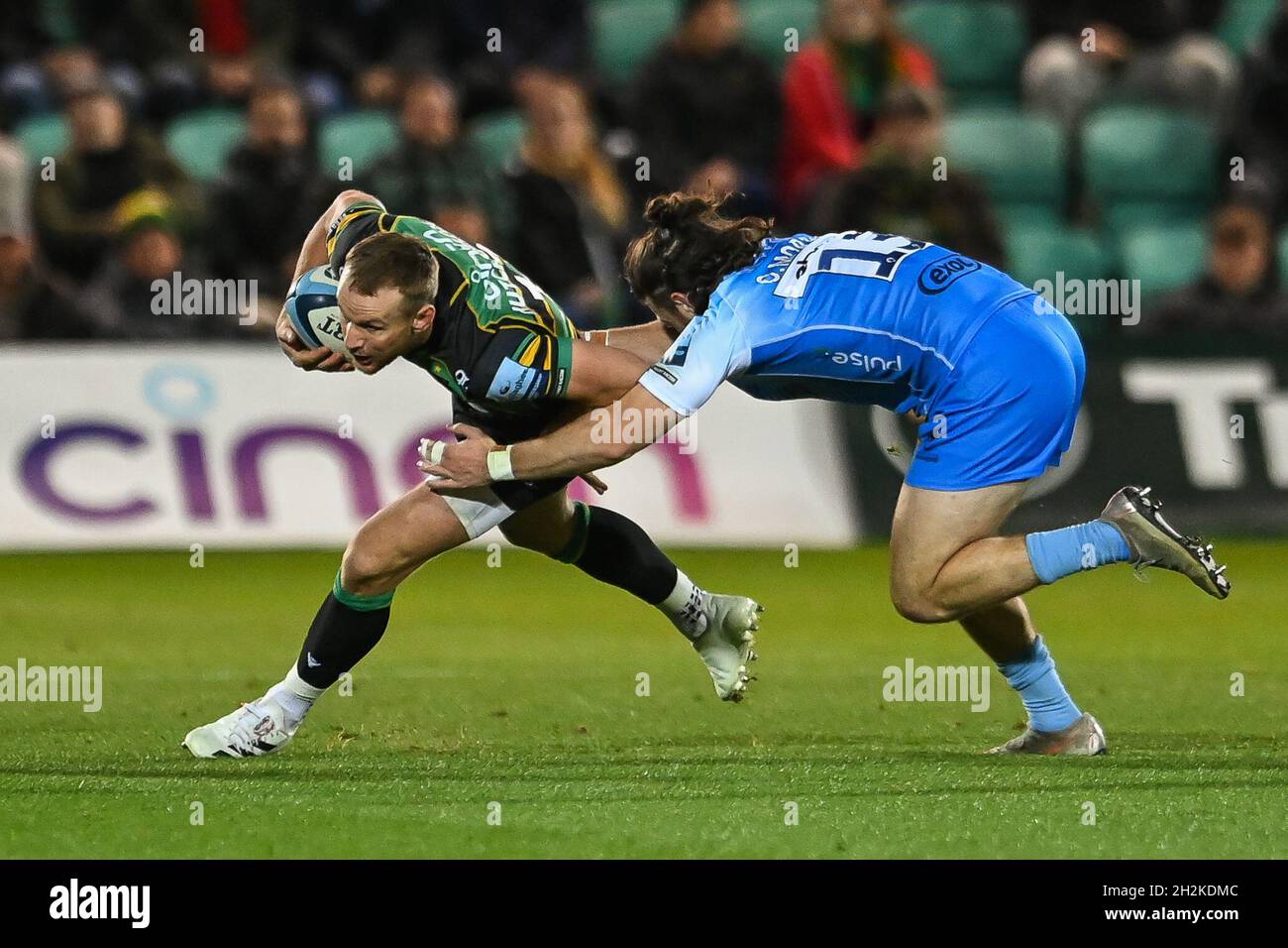 Rory Hutchinson of Northampton Saints evades the tackle of Oli Morris ...
