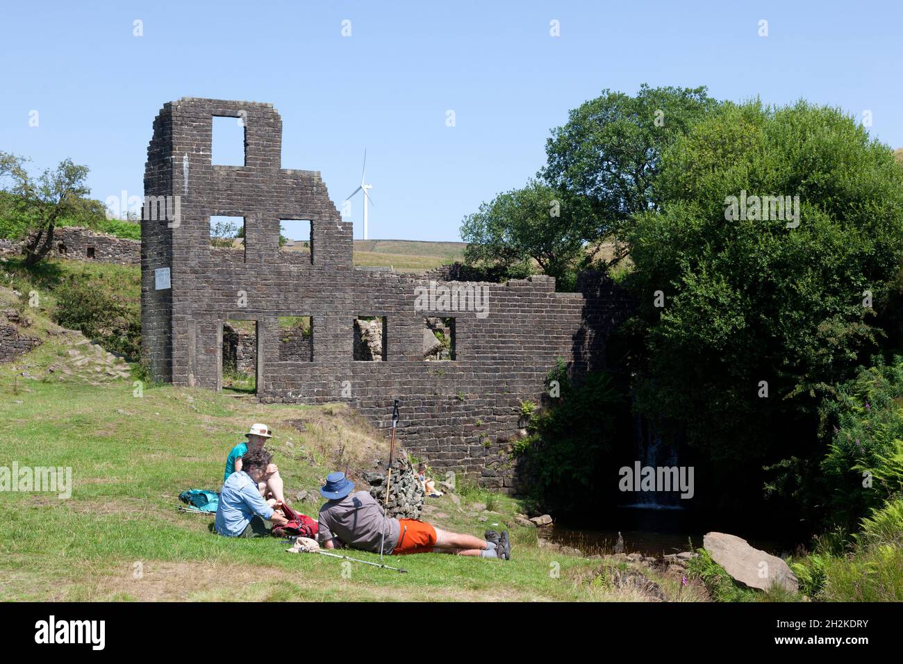 Walkers relaxing beside the ruins of Cheesden Lumb Mill in the Cheesden ...