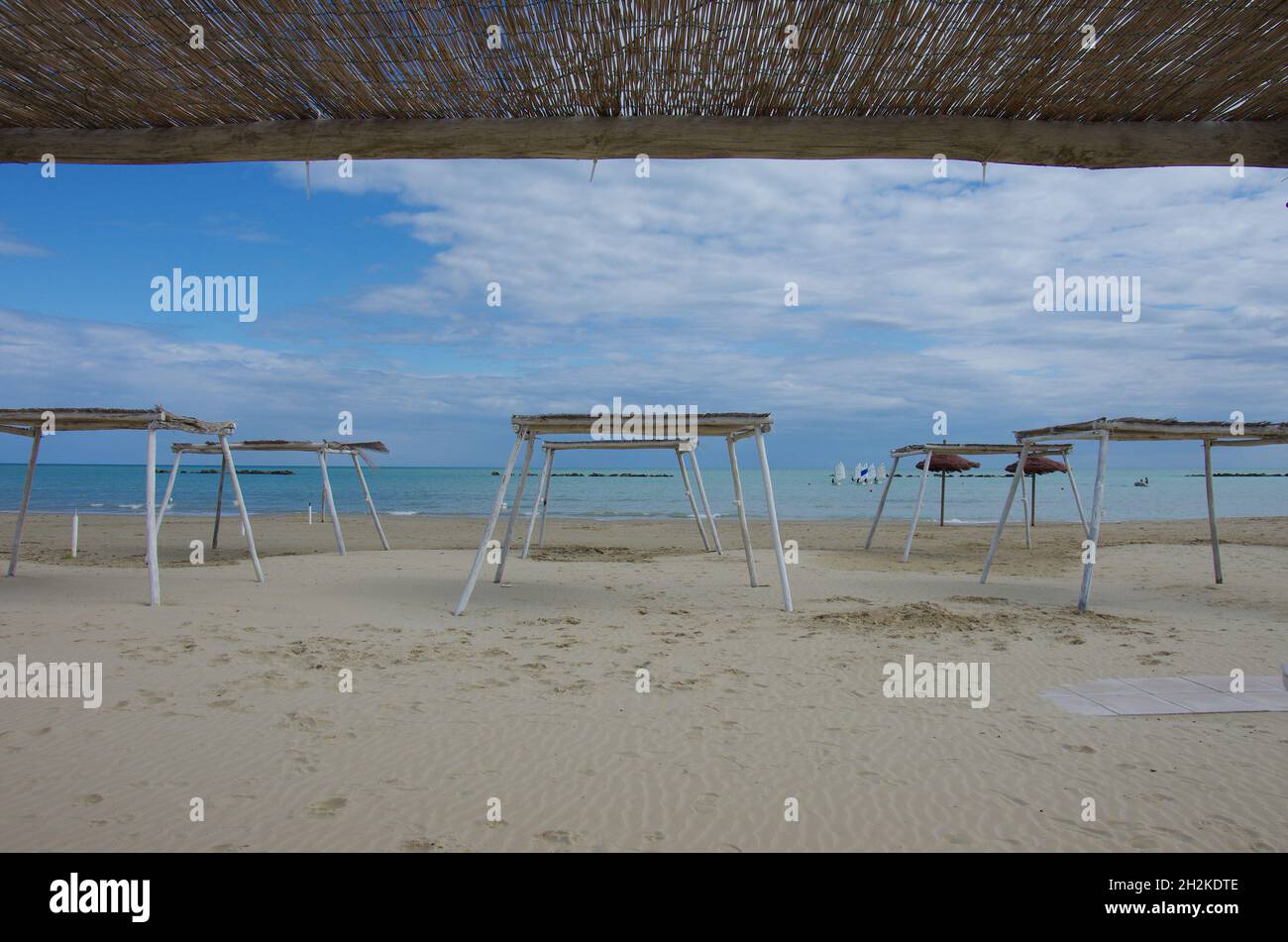 Shelter for the sun on the deserted beach Stock Photo - Alamy