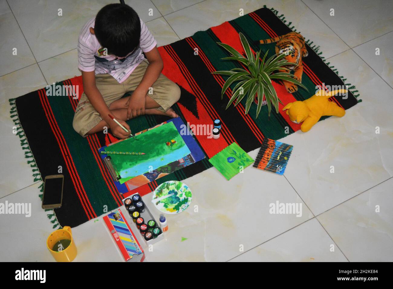 Little boy is drawing something Stock Photo - Alamy
