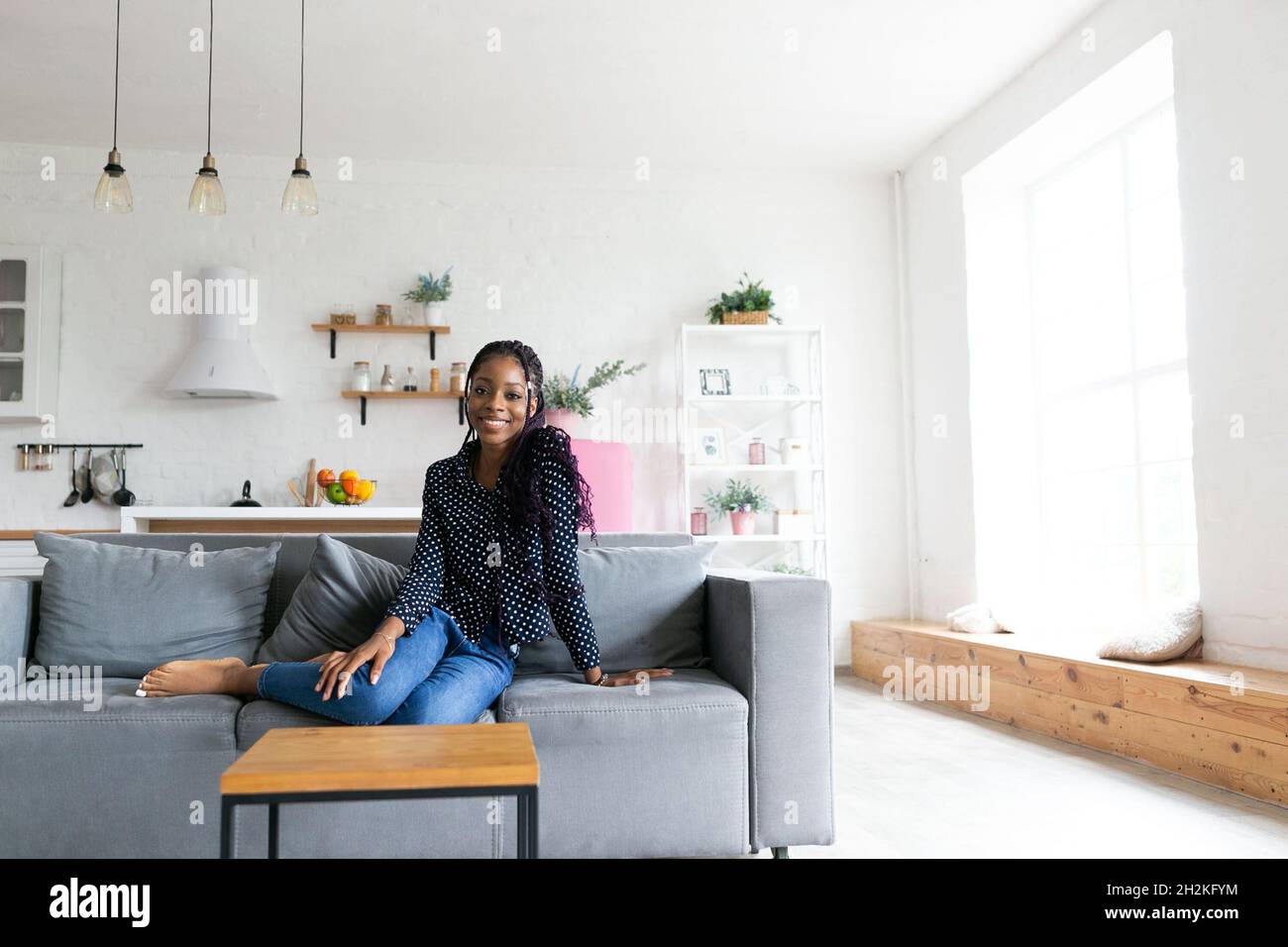 Portrait young black woman smiling happy braids Stock Photo - Alamy