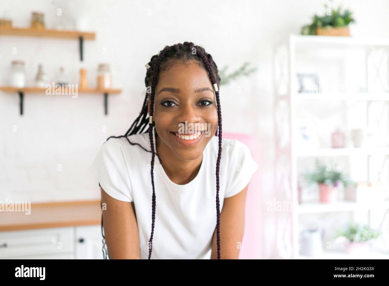 Portrait young black woman smiling happy braids Stock Photo - Alamy