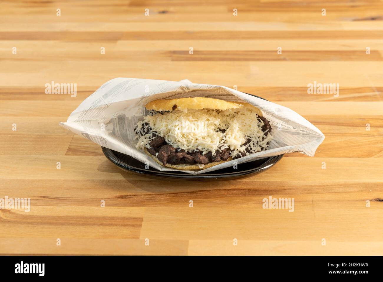 Venezuelan arepa domino of corn dough stuffed with black bean stew with ...
