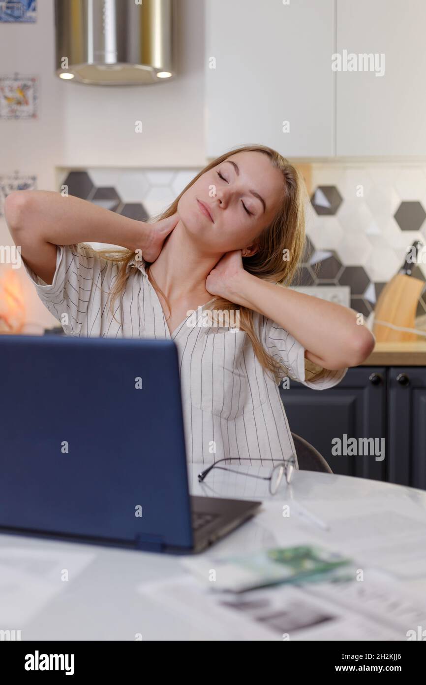Woman working on pc laptop suffering from neck pain, osteochondrosis ...