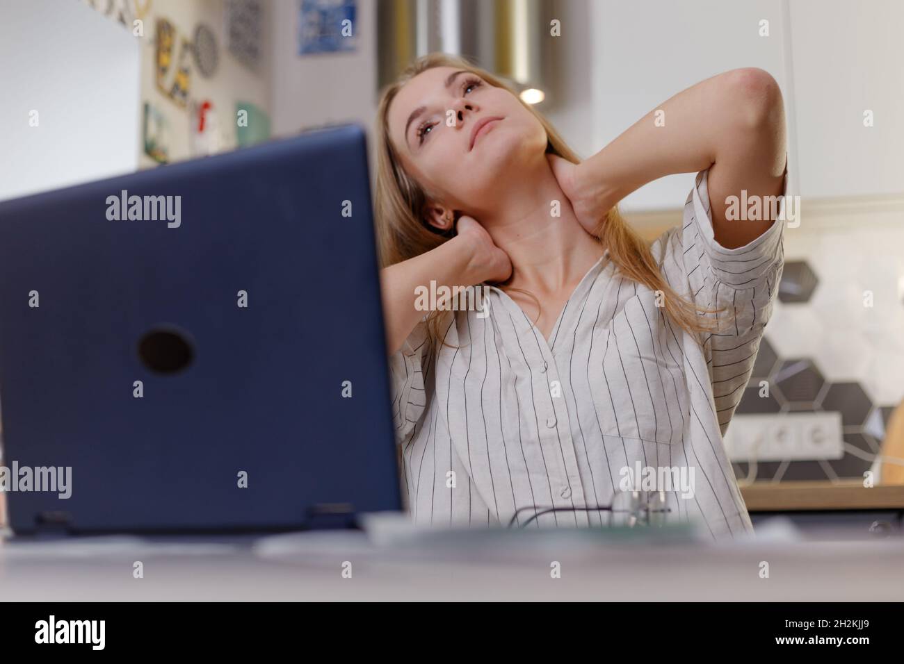 Woman working on pc laptop suffering from neck pain, osteochondrosis ...