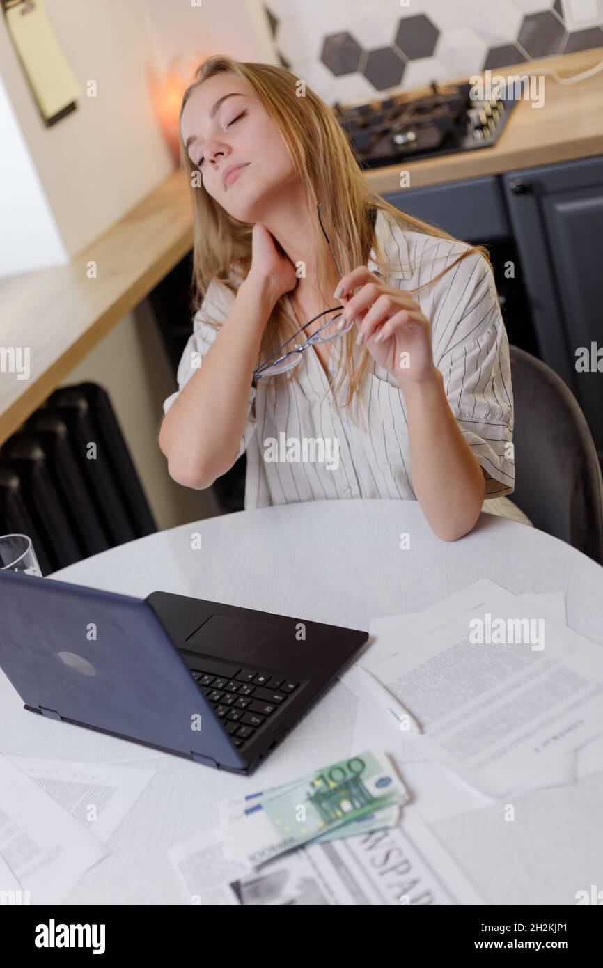 woman working on pc laptop suffering from neck pain, osteochondrosis ...