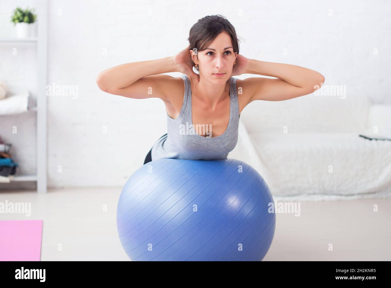 Fitness young woman doing abdominal crunches on fit ball Stock Photo ...
