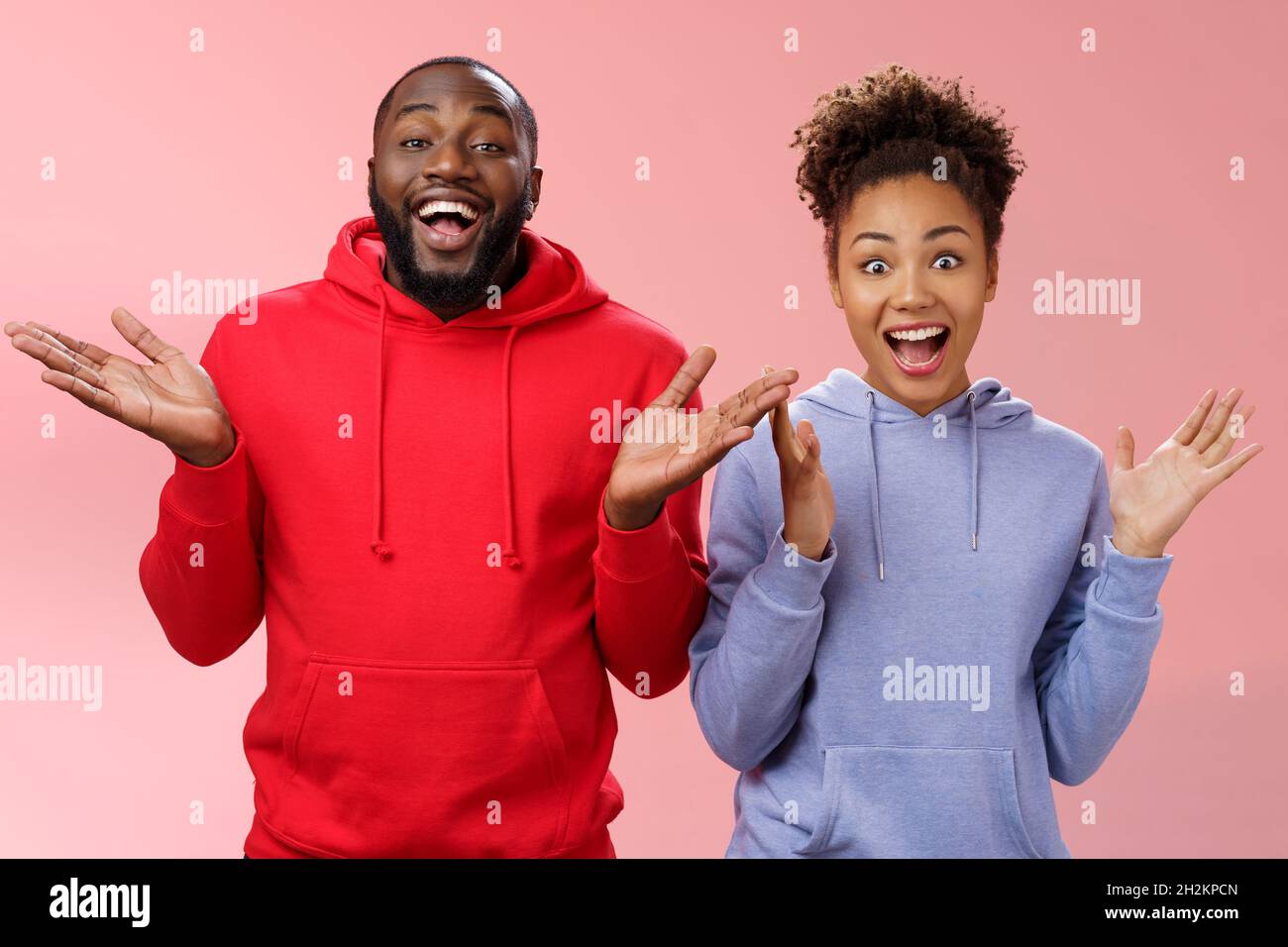 Guys receive nice surprise. Two attractive carefree surprised happy ...