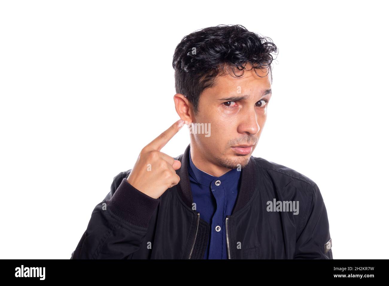 Man indicating to be heard, isolated on white background. Young adult ...