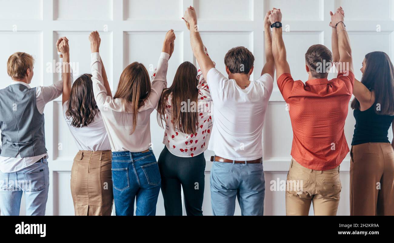 Back view of people holding hands. Together, we are stronger Stock ...
