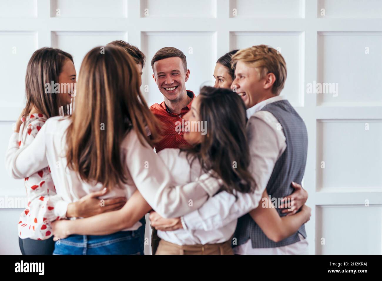 Group of people standing in circle in personal growth training Stock ...
