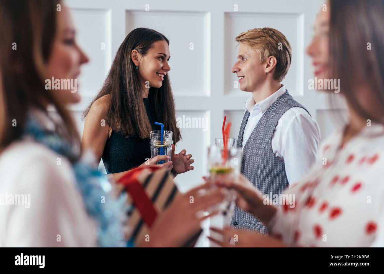 Group of people celebrating, talking, drinking cocktails Stock Photo ...