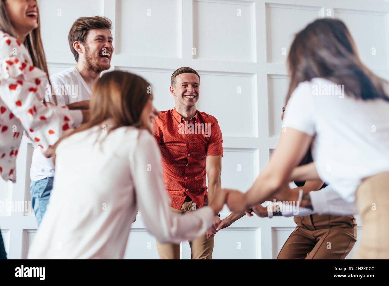 People hold hands, play and have fun Stock Photo - Alamy