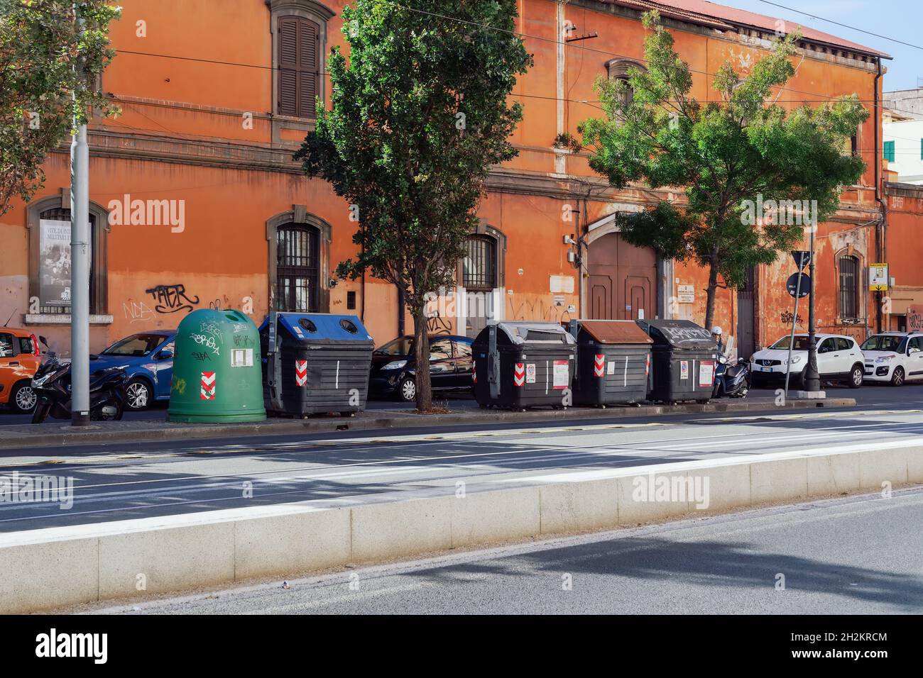 Rome, Italy big garbage bins next to a road. A series of dumpsters used ...