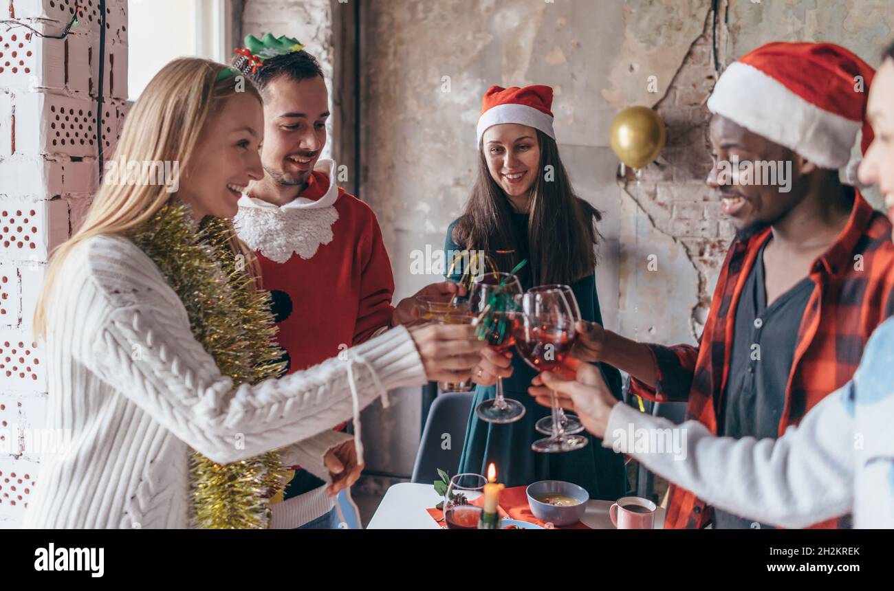 Group of people celebrating Christmas or New Year eve Stock Photo - Alamy