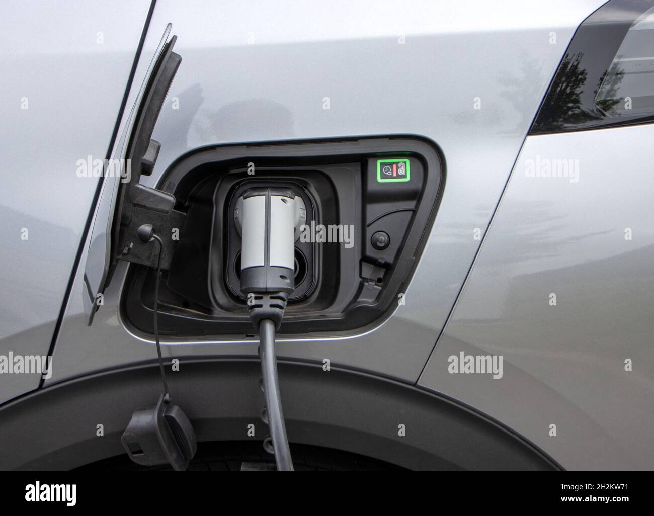 Electric car charging Stock Photo - Alamy