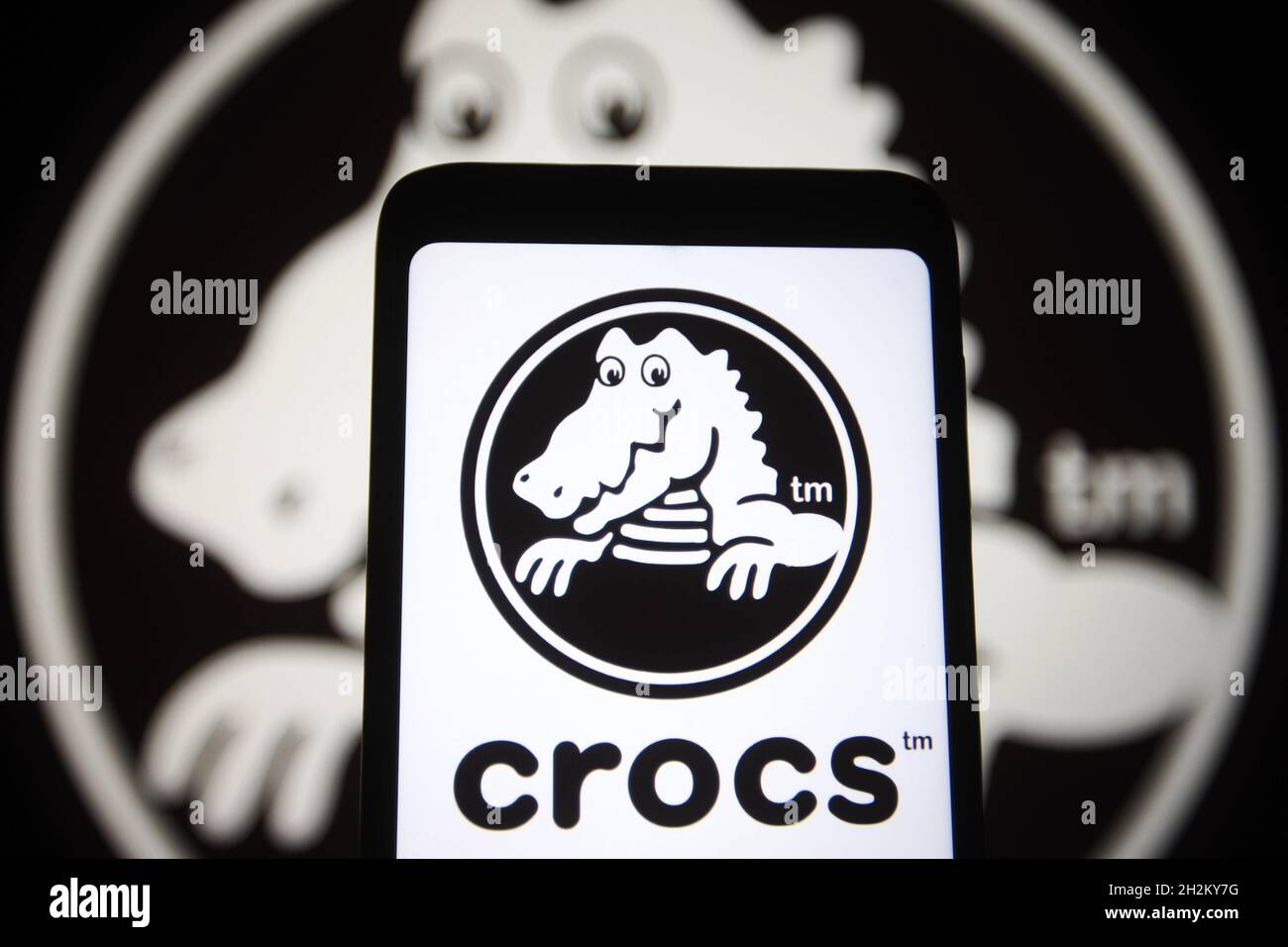 In this photo illustration a Crocs Inc. logo is seen on a smartphone ...