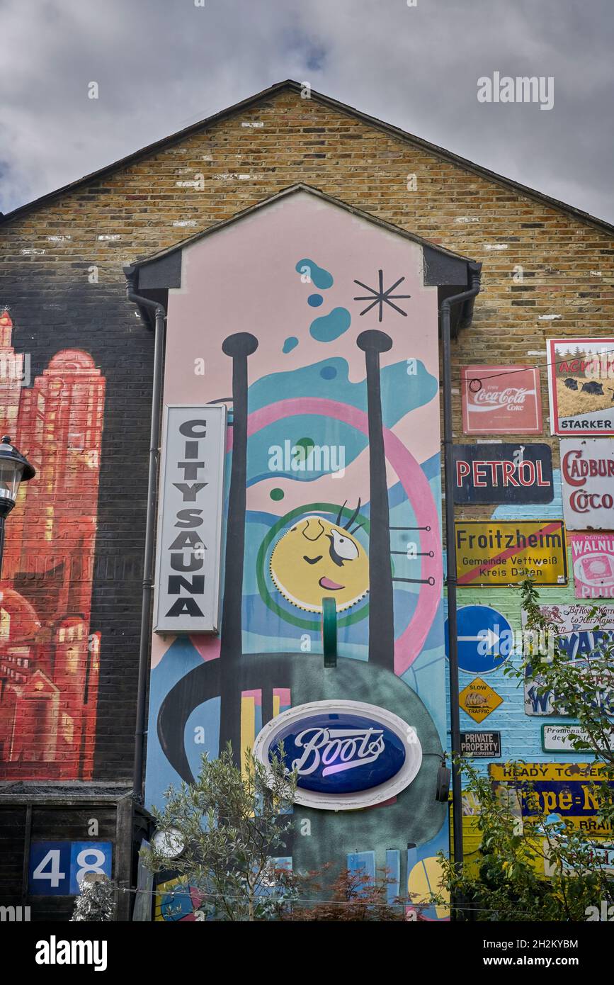 house covered in shop signs hackney Stock Photo - Alamy