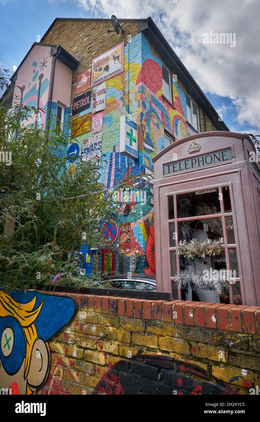 house covered in shop signs hackney Stock Photo - Alamy