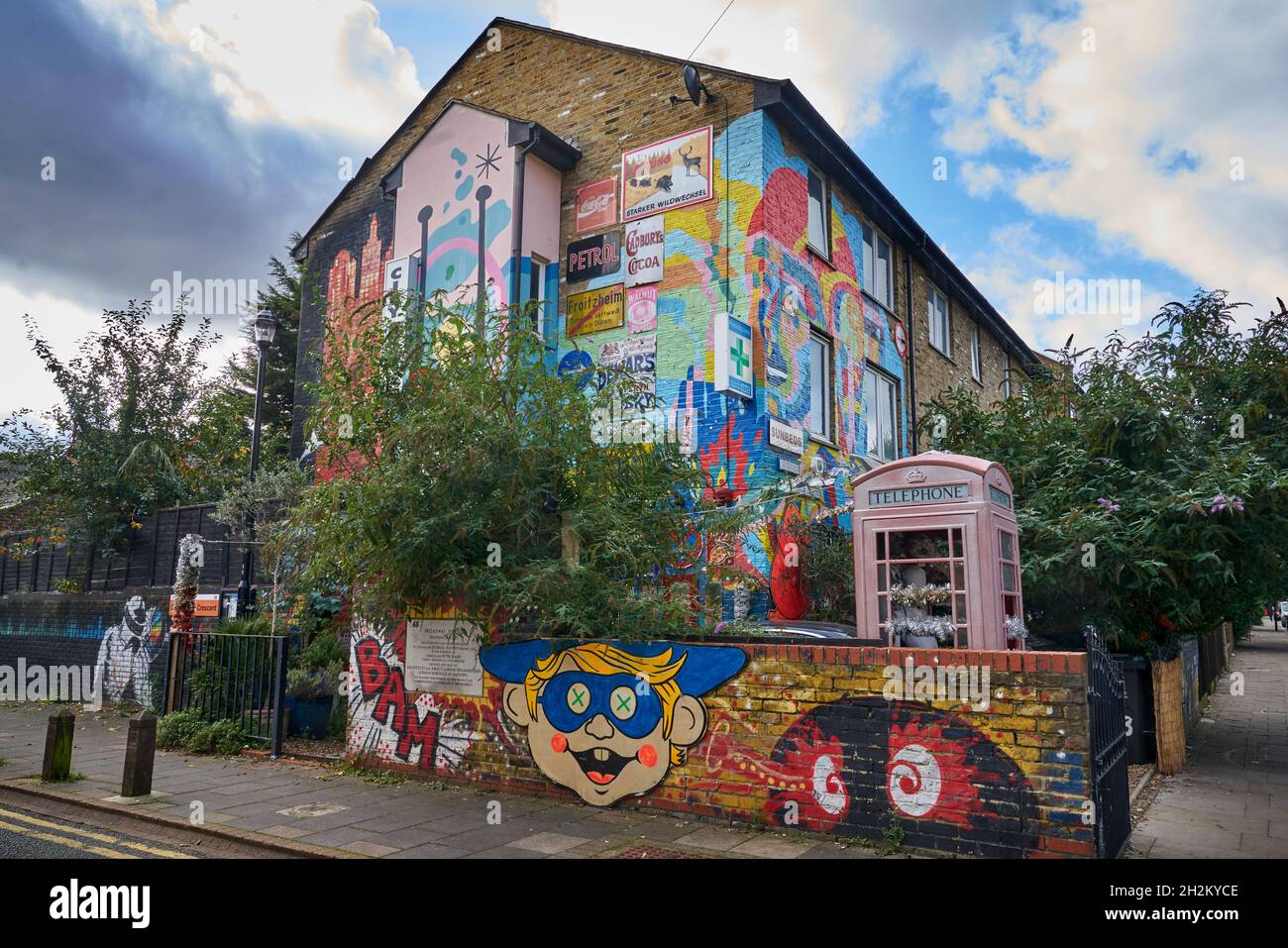house covered in shop signs hackney Stock Photo - Alamy