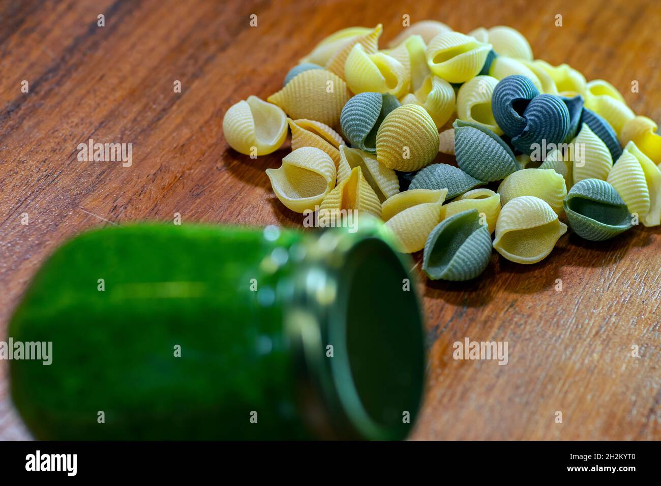 Colored raw pasta. Conchiglie pasta Stock Photo - Alamy