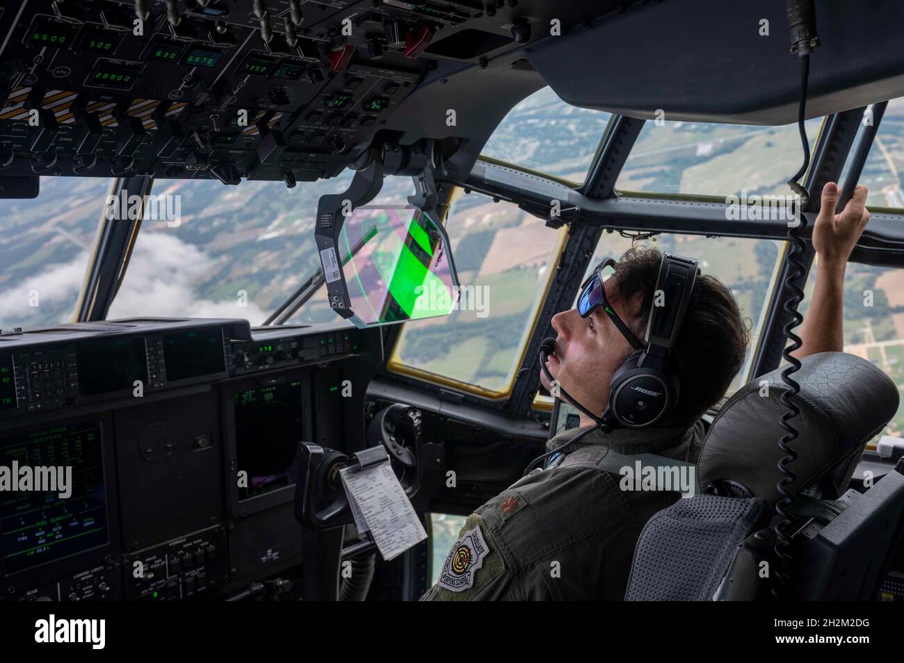 Maj. Ian Kemp, 29th Weapons Squadron graduate, flies a C-130J Super ...