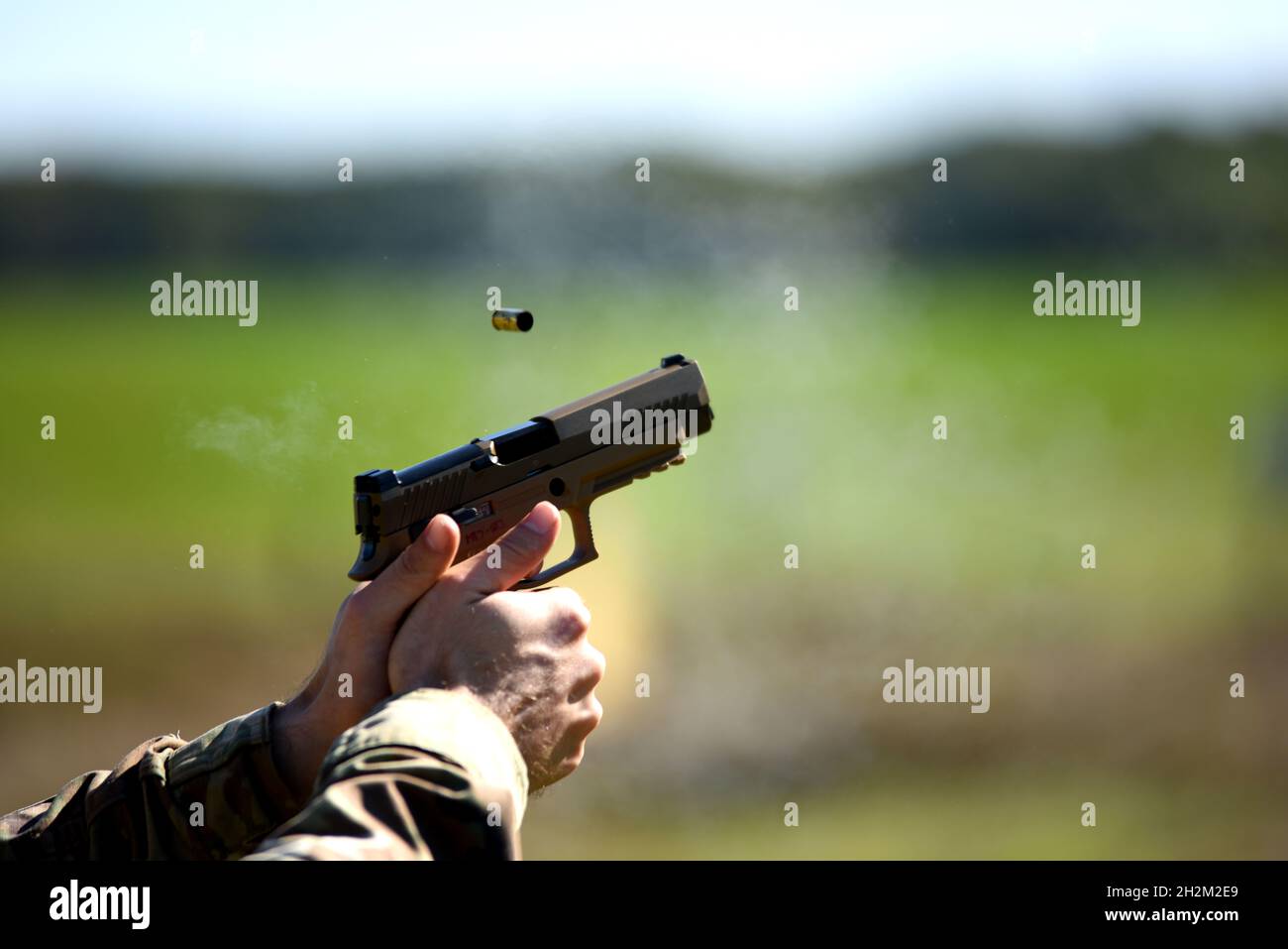 A Soldier with the Michigan Army National Guard (MIARNG) shoots the M17 ...
