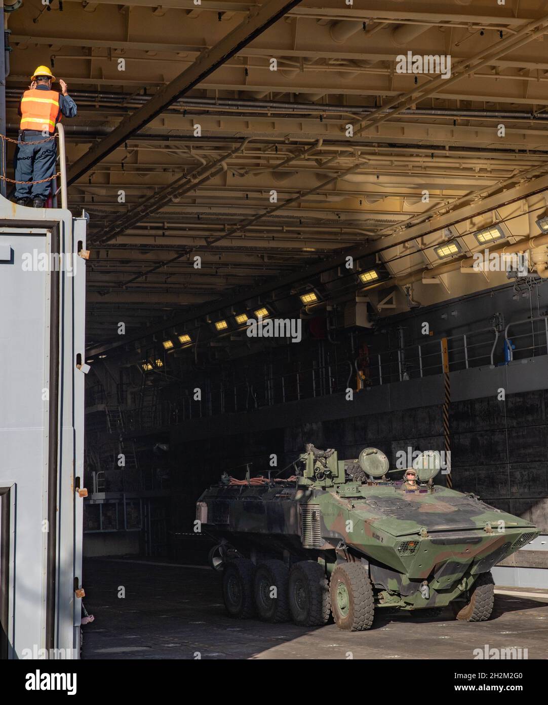 U.S. Marines and Sailors offload amphibious combat vehicles (ACVs) with ...