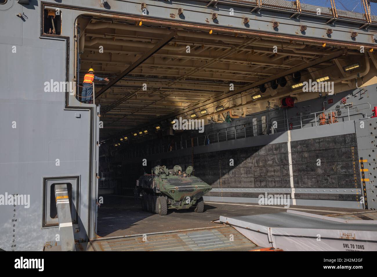 U.S. Marines and Sailors offload amphibious combat vehicles (ACVs) with ...
