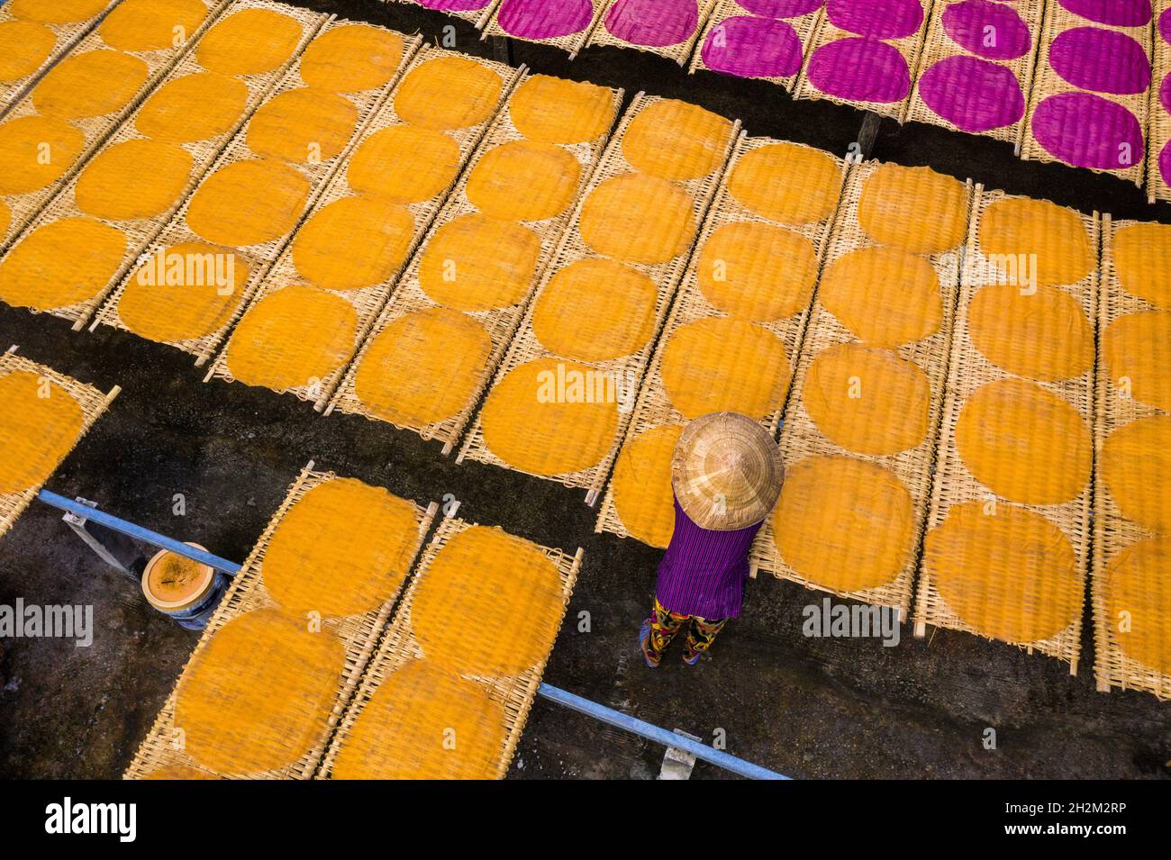 Workers are drying rice noodles in the sun Stock Photo - Alamy