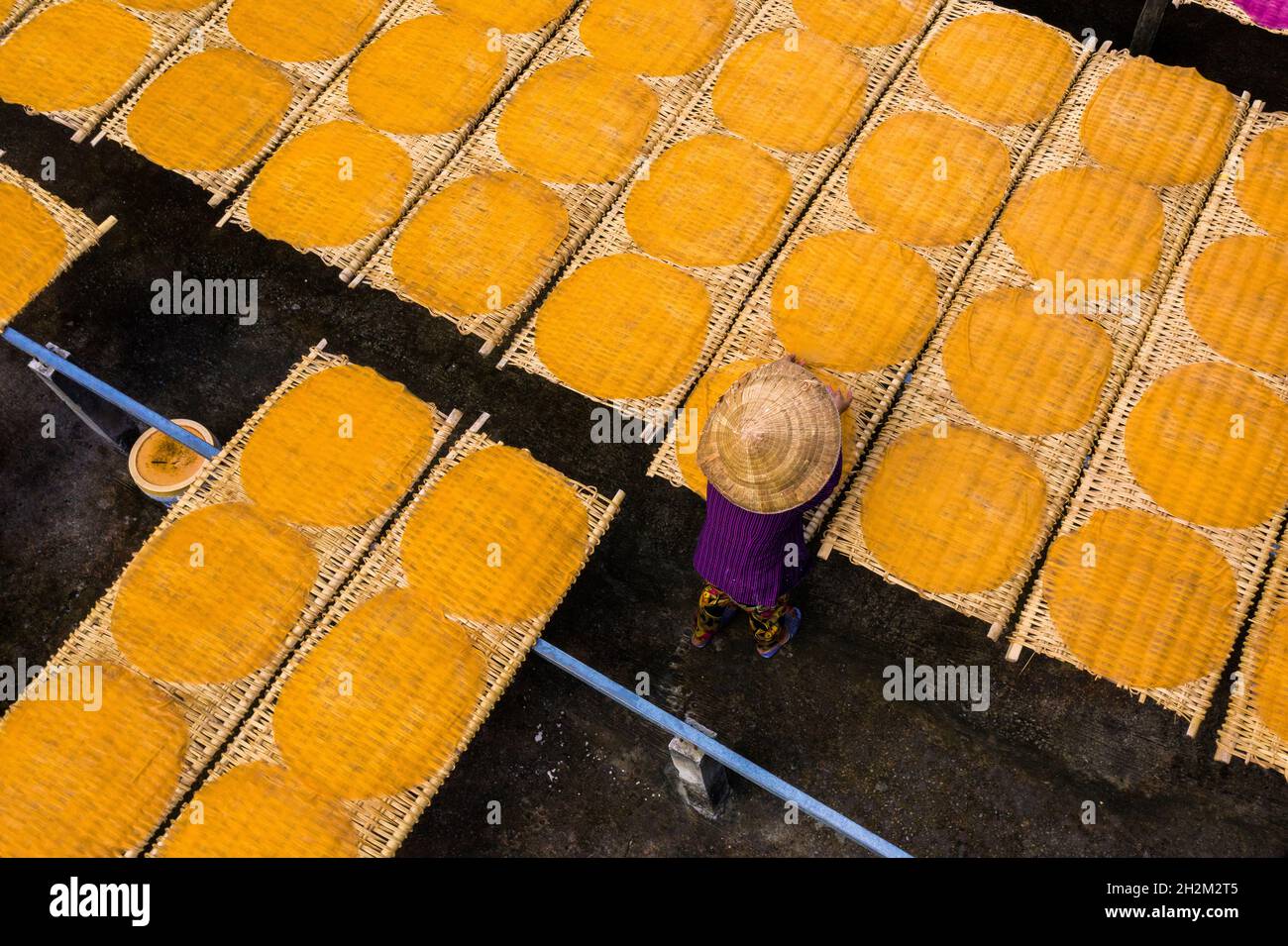 Workers are drying rice noodles in the sun Stock Photo - Alamy
