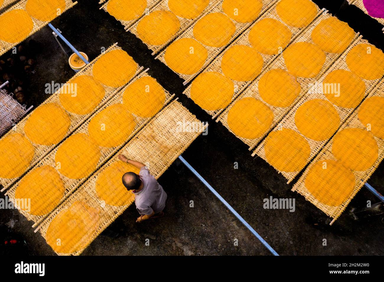Workers are drying rice noodles in the sun Stock Photo - Alamy