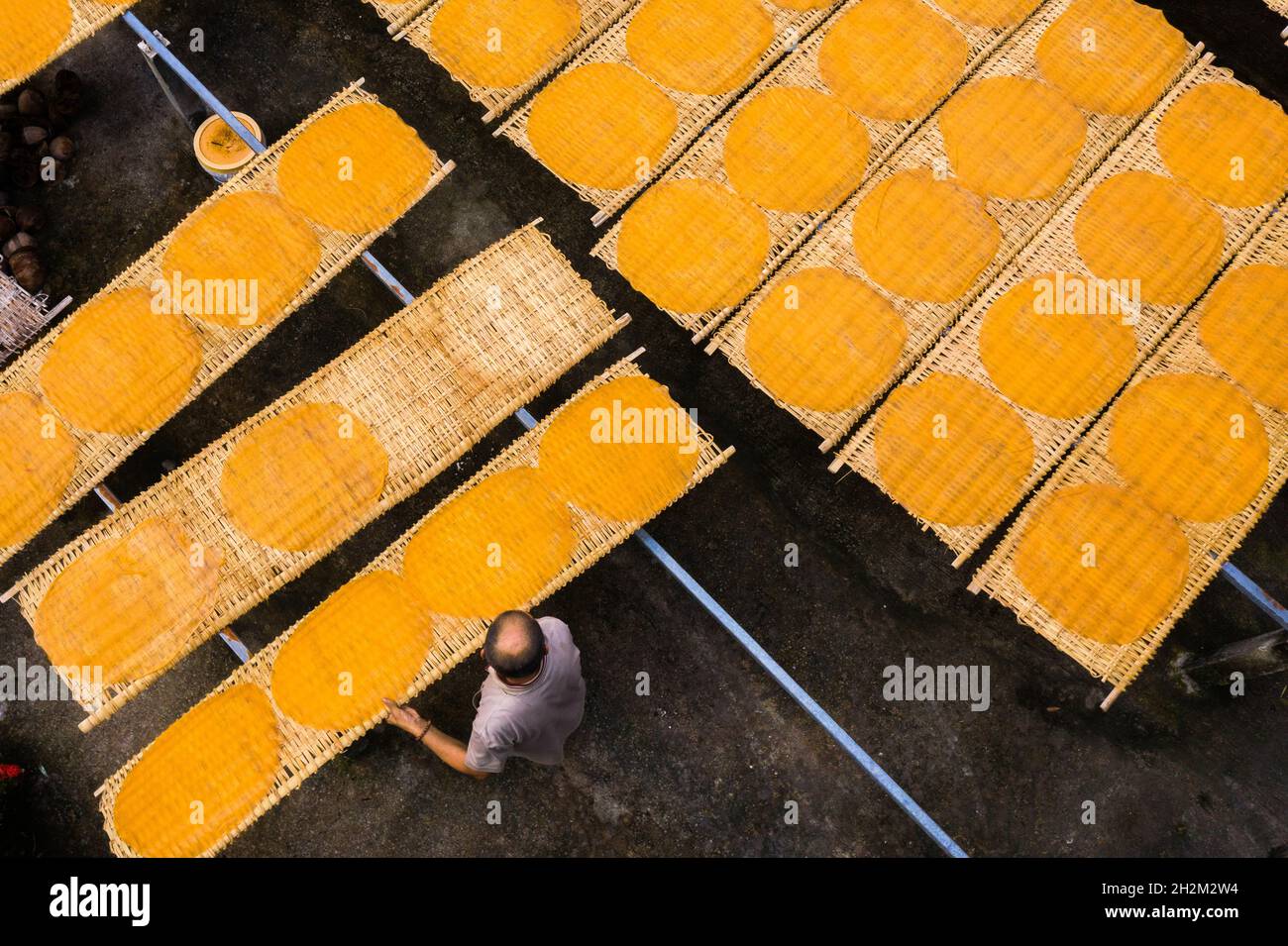 Workers are drying rice noodles in the sun Stock Photo - Alamy