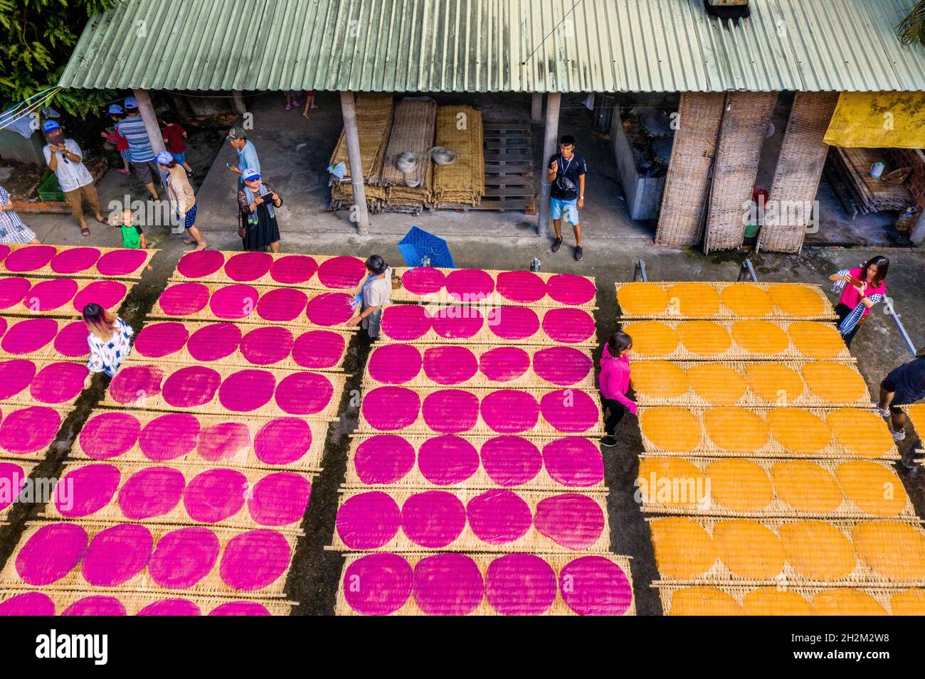 Workers are drying rice noodles in the sun Stock Photo - Alamy