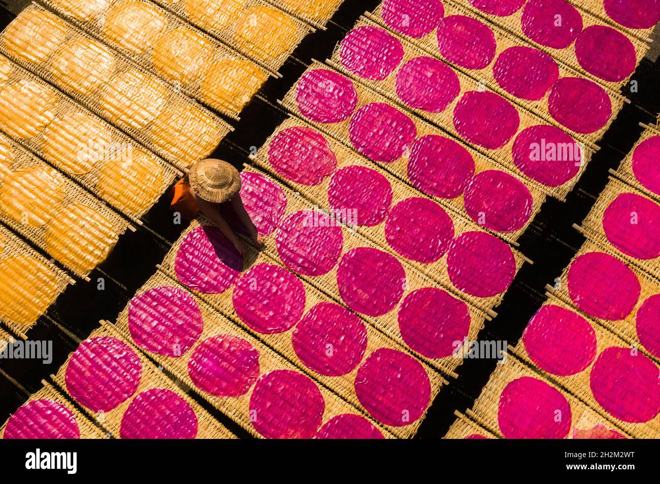 Workers are drying rice noodles in the sun Stock Photo - Alamy