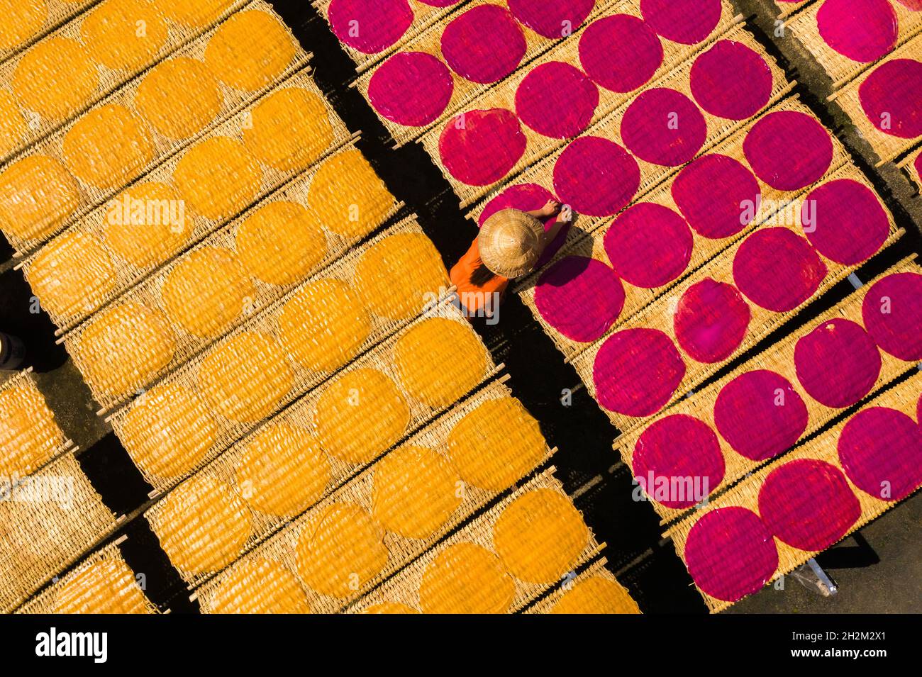 Workers are drying rice noodles in the sun Stock Photo - Alamy