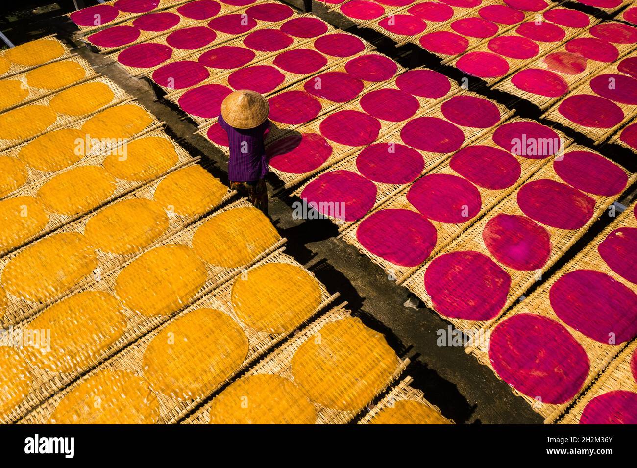 Workers are drying rice noodles in the sun Stock Photo - Alamy
