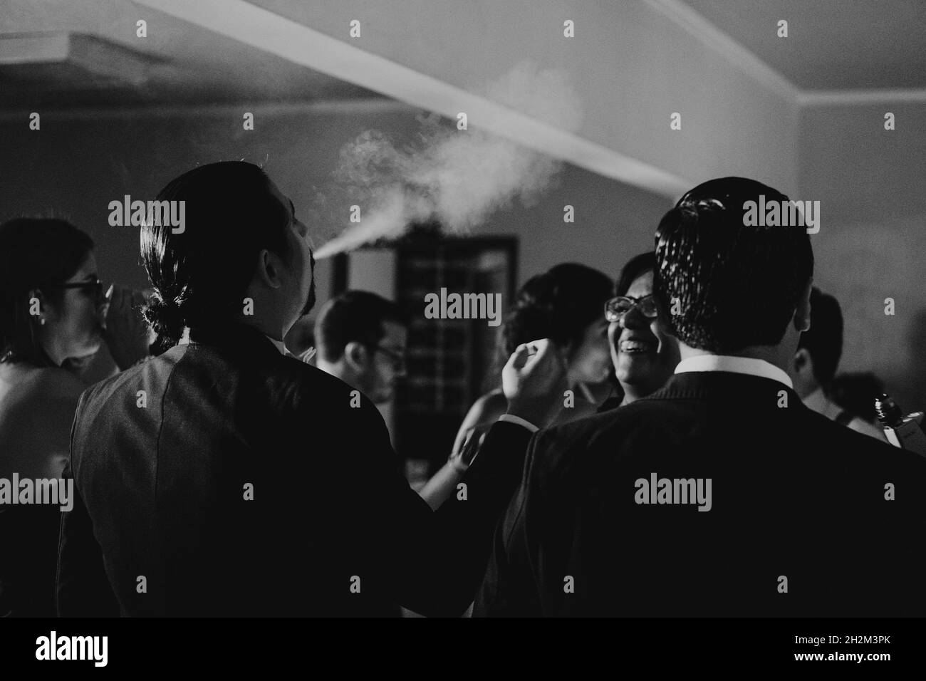 the groom was smoking at his weeding party while dancing Stock Photo ...