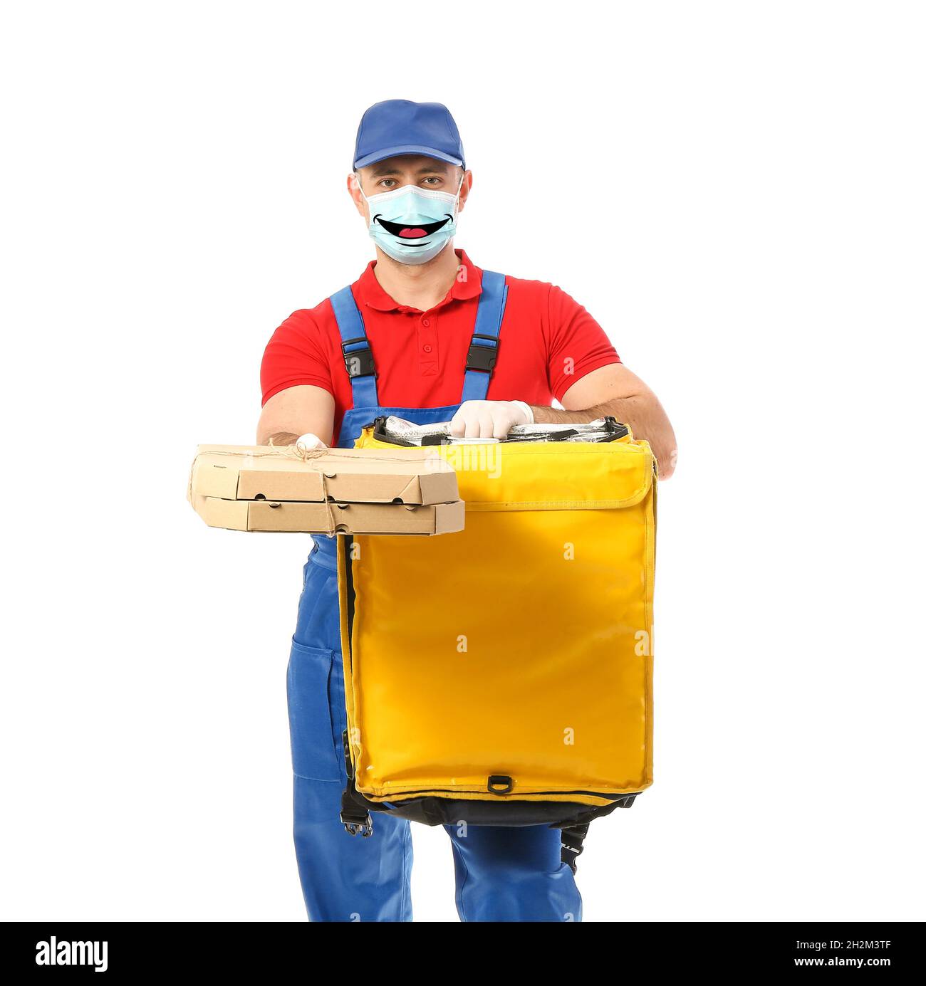 Courier wearing medical mask with drawn smile against white background ...