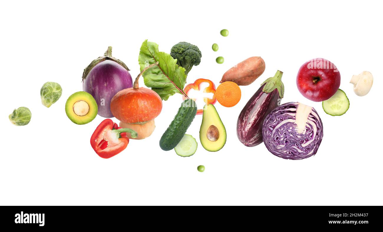 Flying fresh vegetables on white background Stock Photo - Alamy