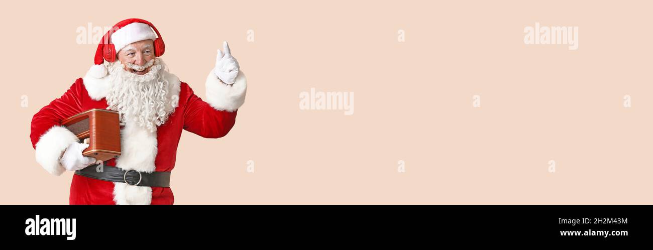 Portrait of Santa Claus with retro radio receiver on light background ...