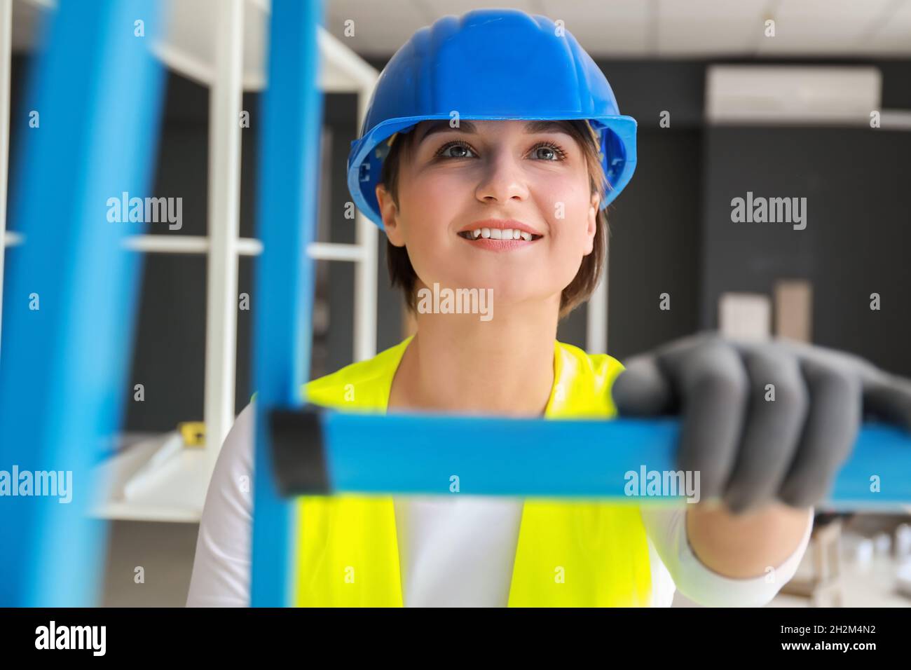 Female construction worker near ladder in room, closeup Stock Photo - Alamy