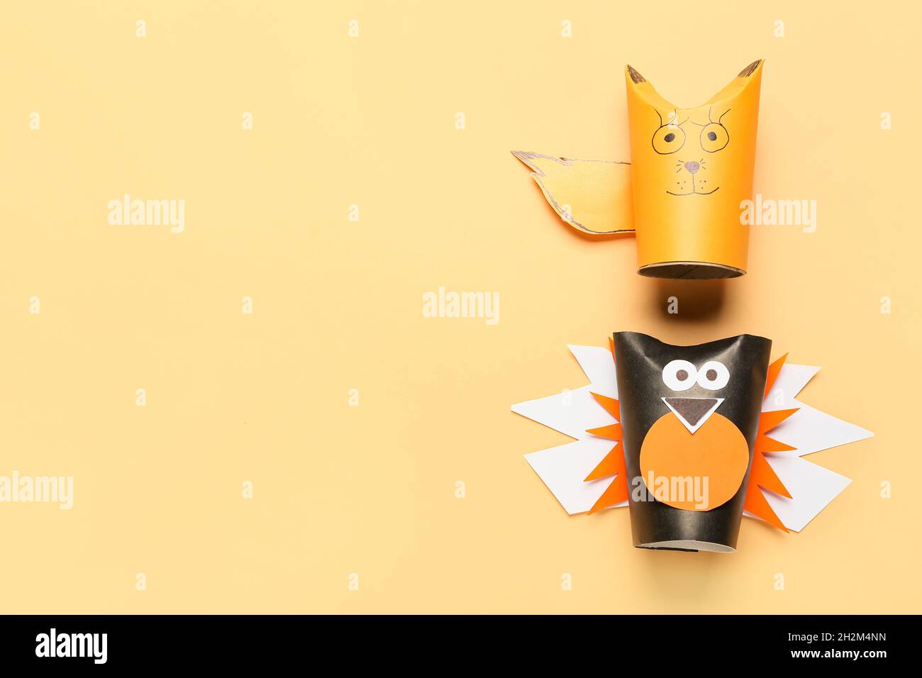 Bird and fox made of cardboard tubes for toilet paper on color ...